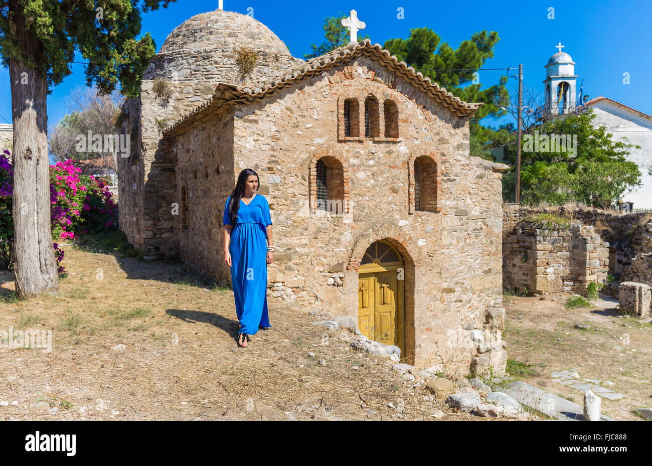 beautiful greek young brunet woman in blue dress Stock Photo - Alamy