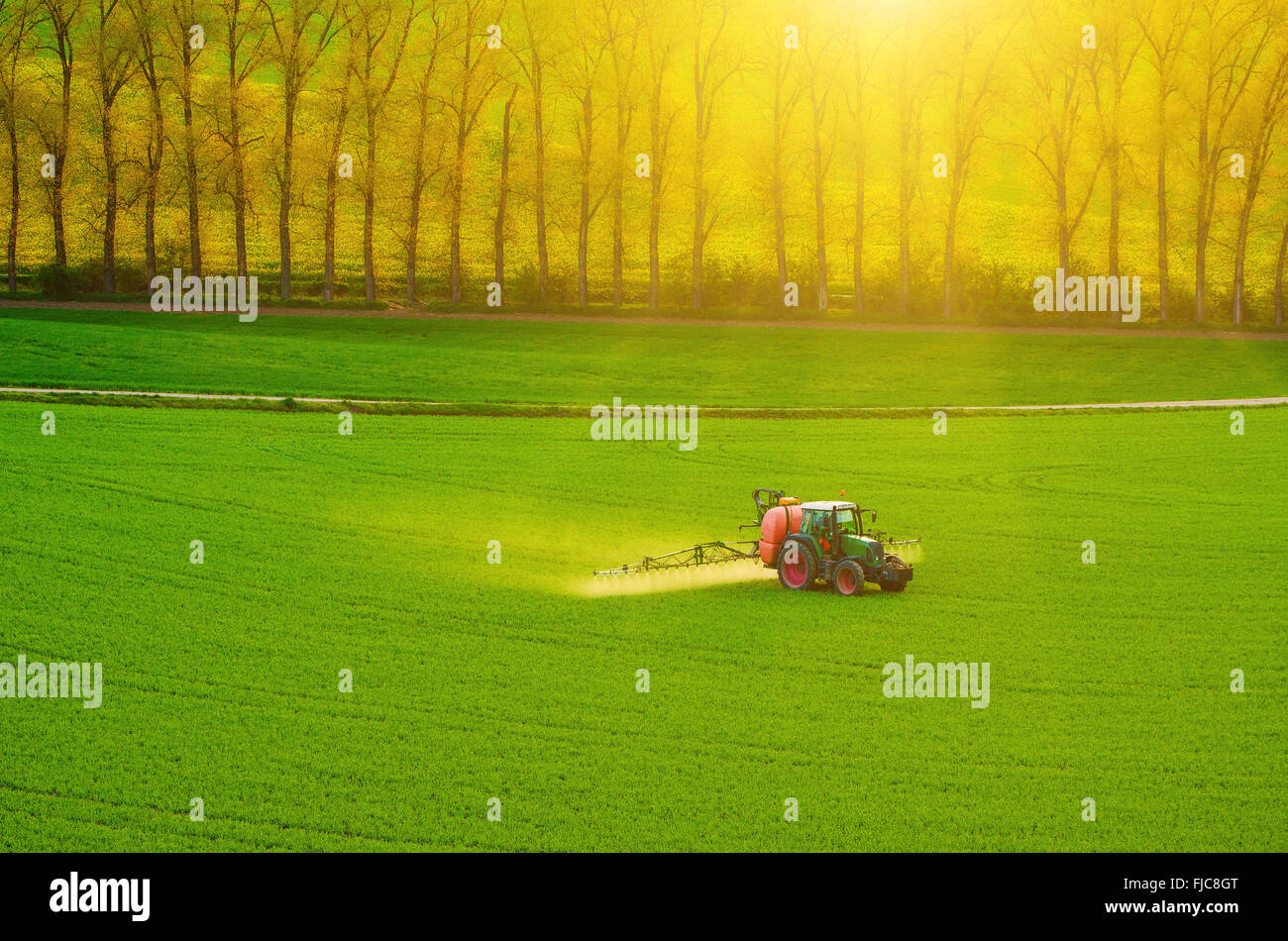 Farm machinery spraying insecticide Stock Photo - Alamy