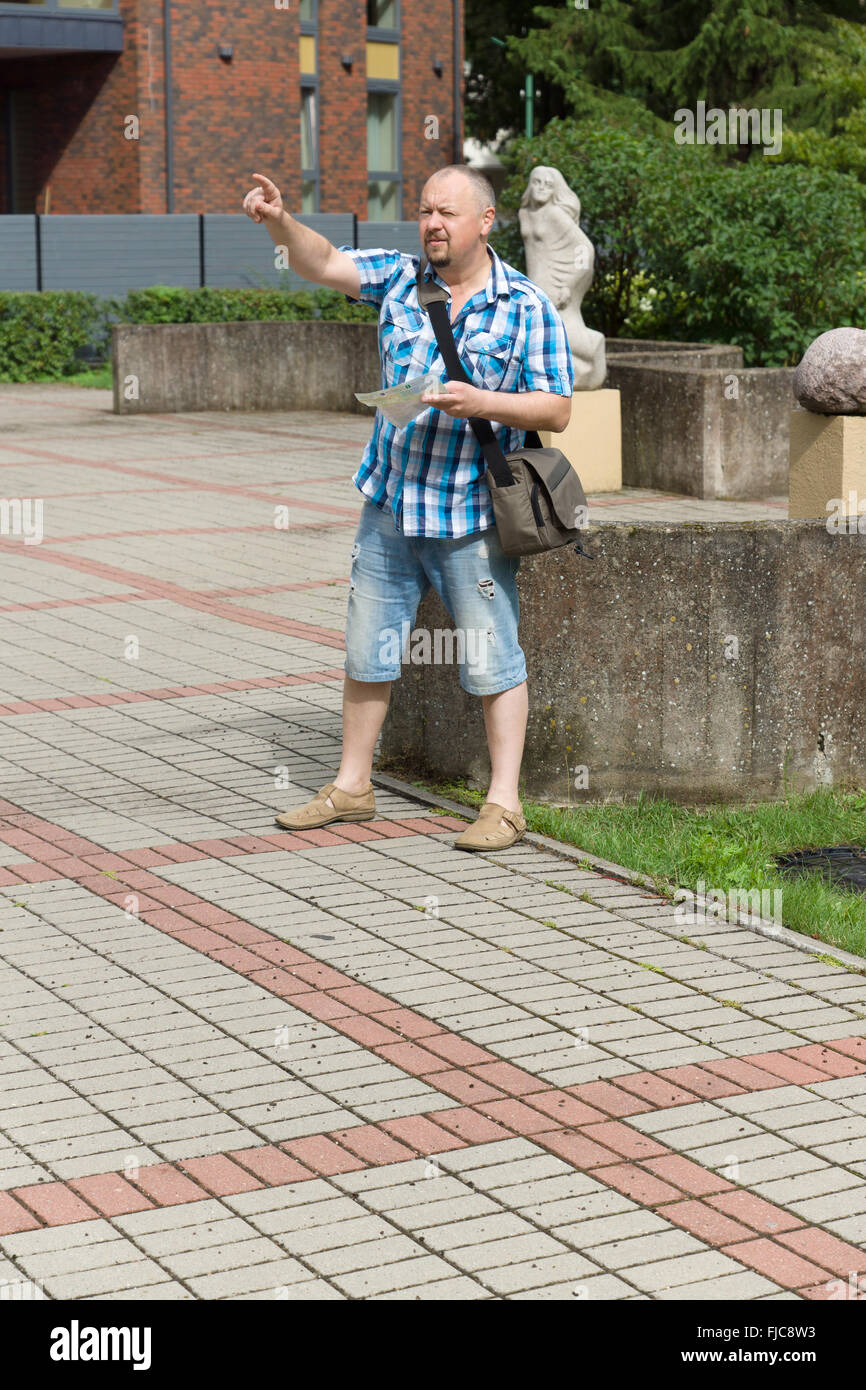 the man the tourist looks round in the unfamiliar city Stock Photo - Alamy