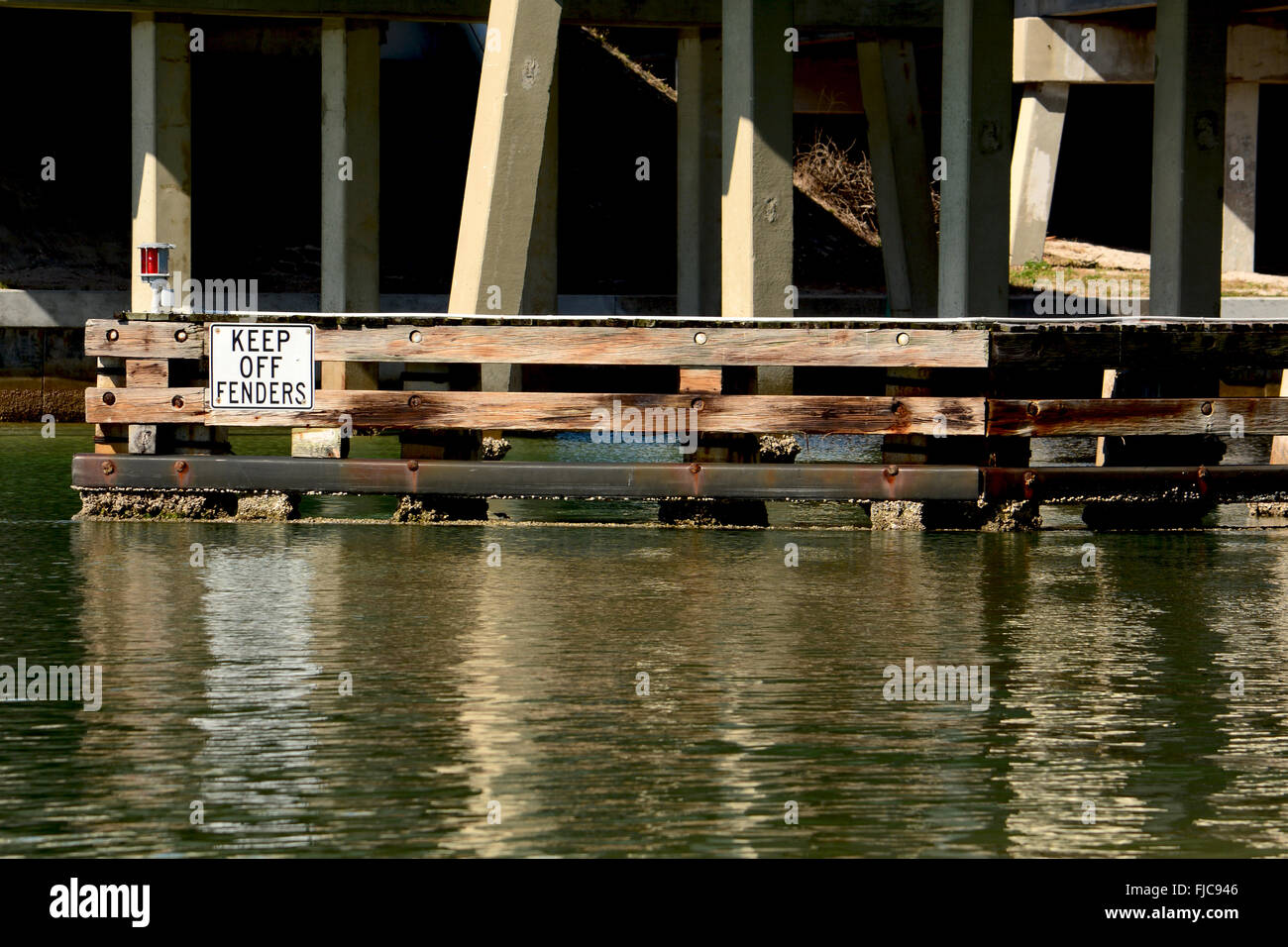 Boating, entrance to boat channel Keep Off Fenders sign close up Stock ...