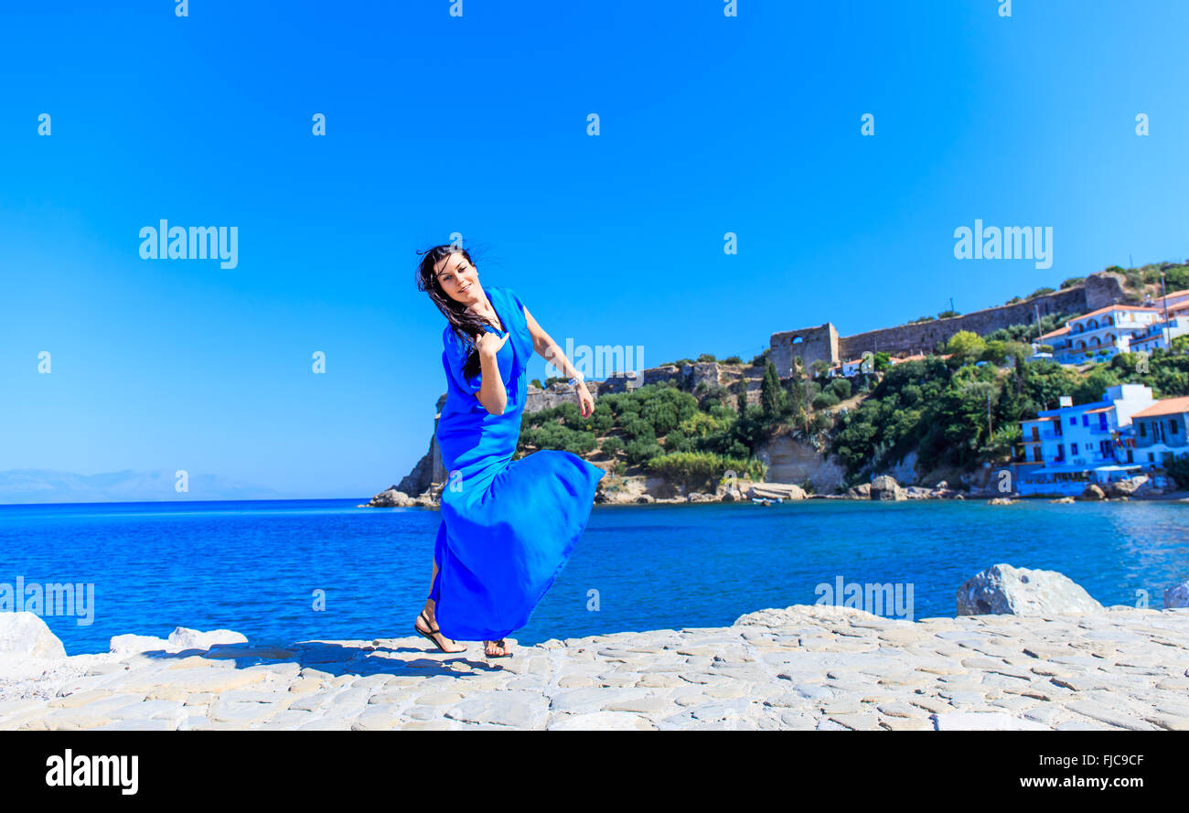 beautiful greek young brunet woman in blue dress Stock Photo - Alamy