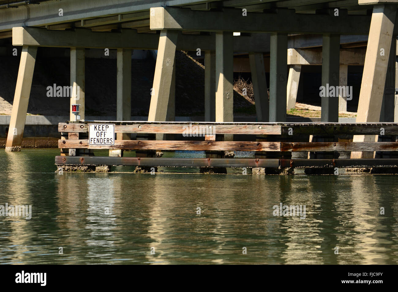 Entrance to the boat channel under the bridge,sign Stock Photo - Alamy