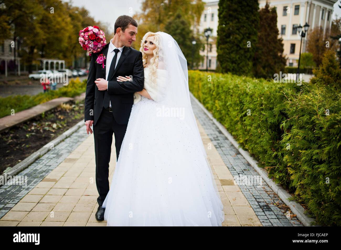 Wedding couple stay and hugging on the trail Stock Photo - Alamy