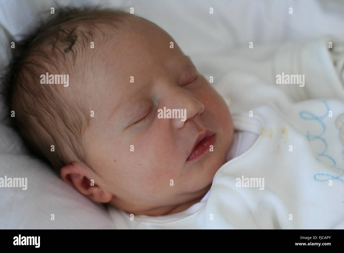 Close up of Newborn baby girl boy child fast asleep Stock Photo - Alamy