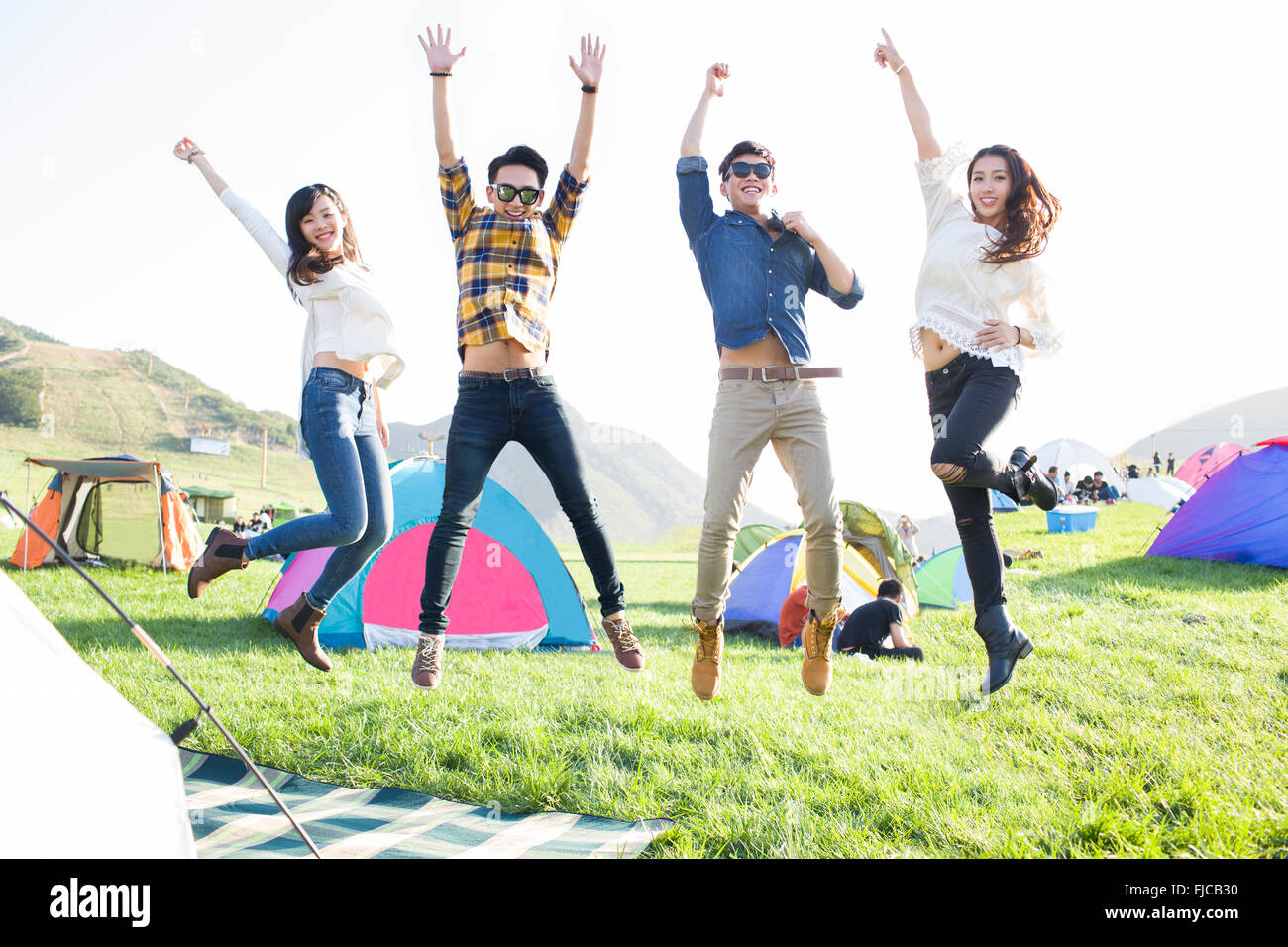 Happy Chinese friends at music festival Stock Photo - Alamy