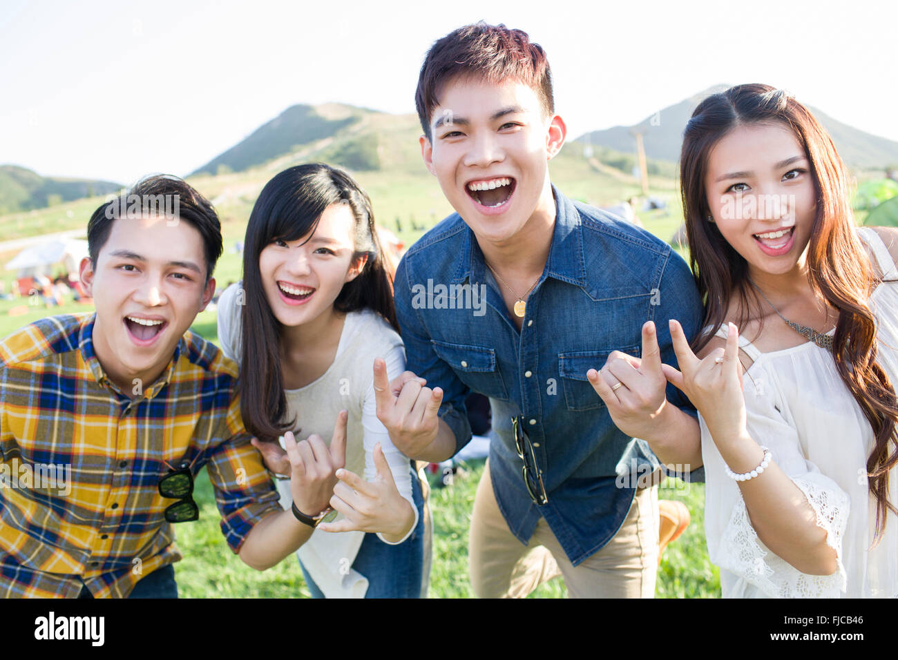 Happy Chinese friends at music festival Stock Photo - Alamy