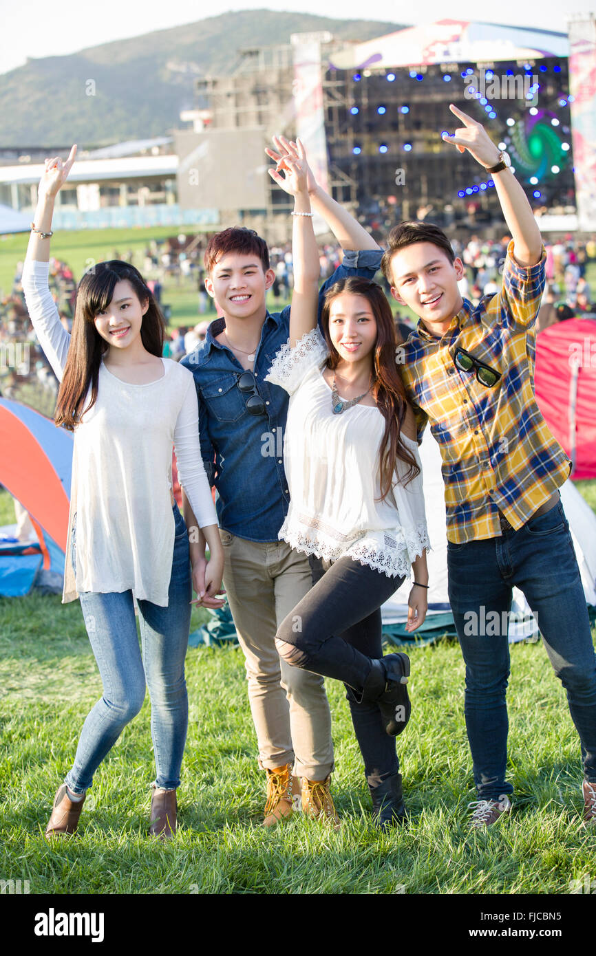 Happy Chinese friends at music festival Stock Photo - Alamy