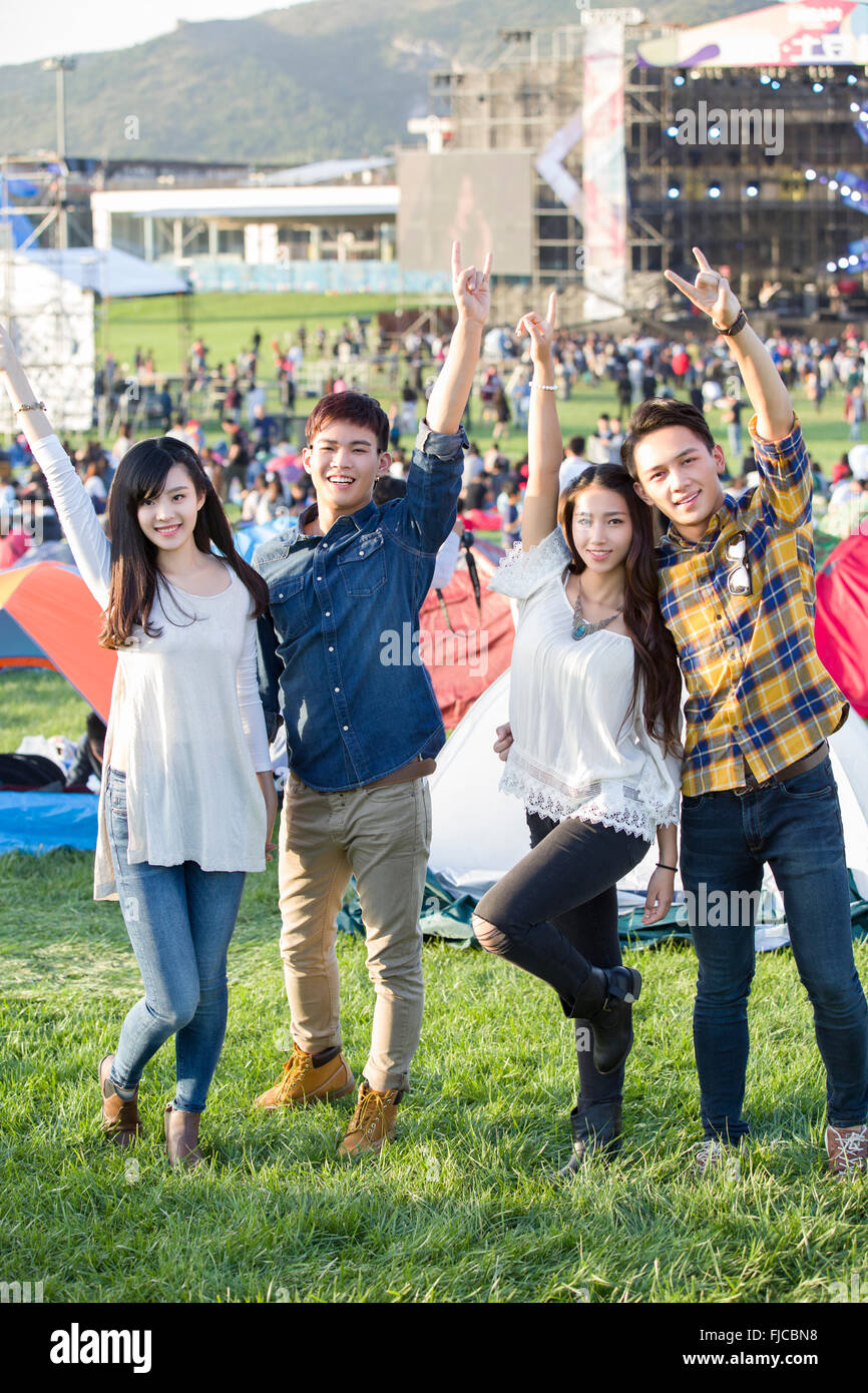 Happy Chinese friends at music festival Stock Photo - Alamy