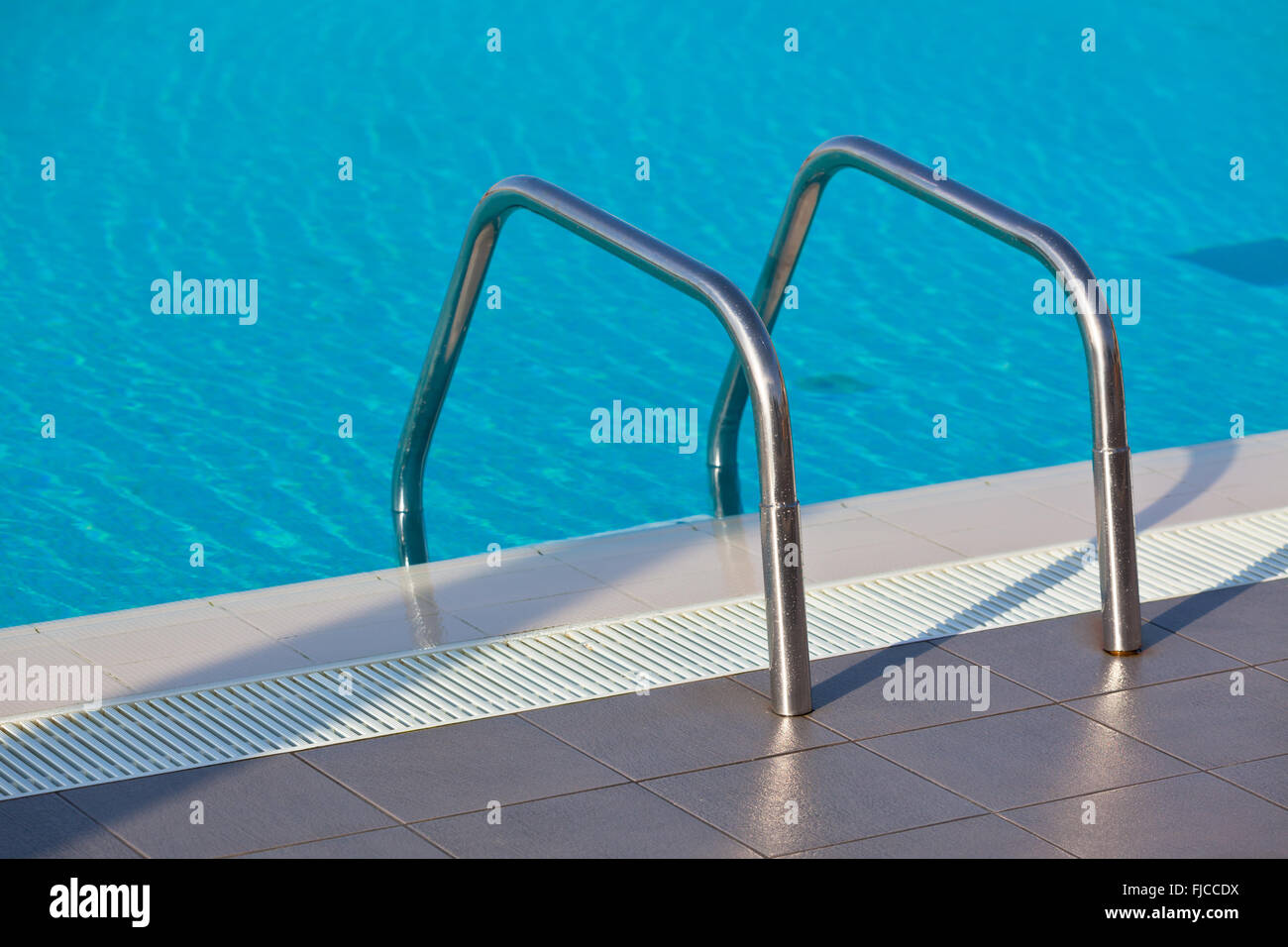 Ladder of a swimming pool. Horizontal shot Stock Photo - Alamy