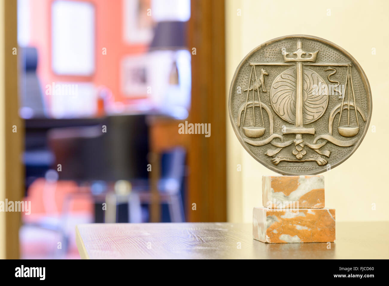 symbol of order with lawyers on table Stock Photo - Alamy