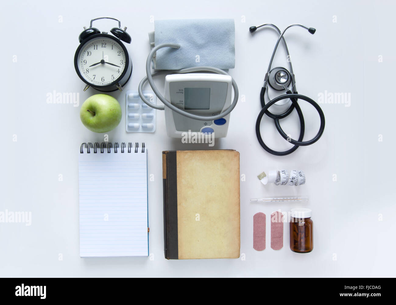 Medical objects laid out on a white table Stock Photo - Alamy