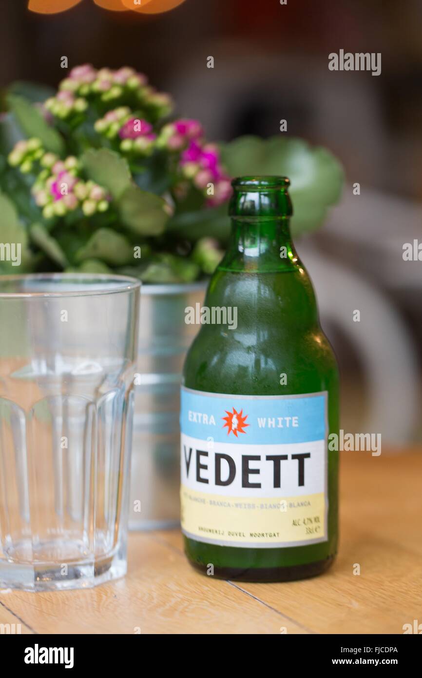 A photo of a belgian beer called Vedett with a bouquet in the ...