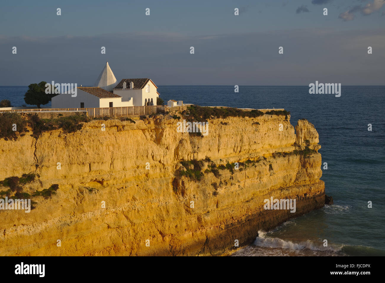 Chapel Nossa Senhora da Rocha on the cliffs in Lagoa, Algarve, Portugal ...