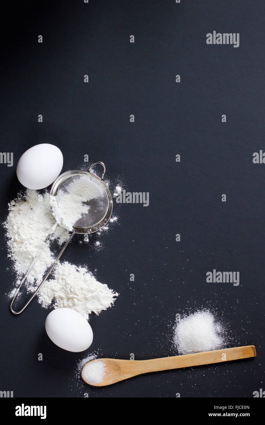 Pastry ingredients on dark background Stock Photo - Alamy