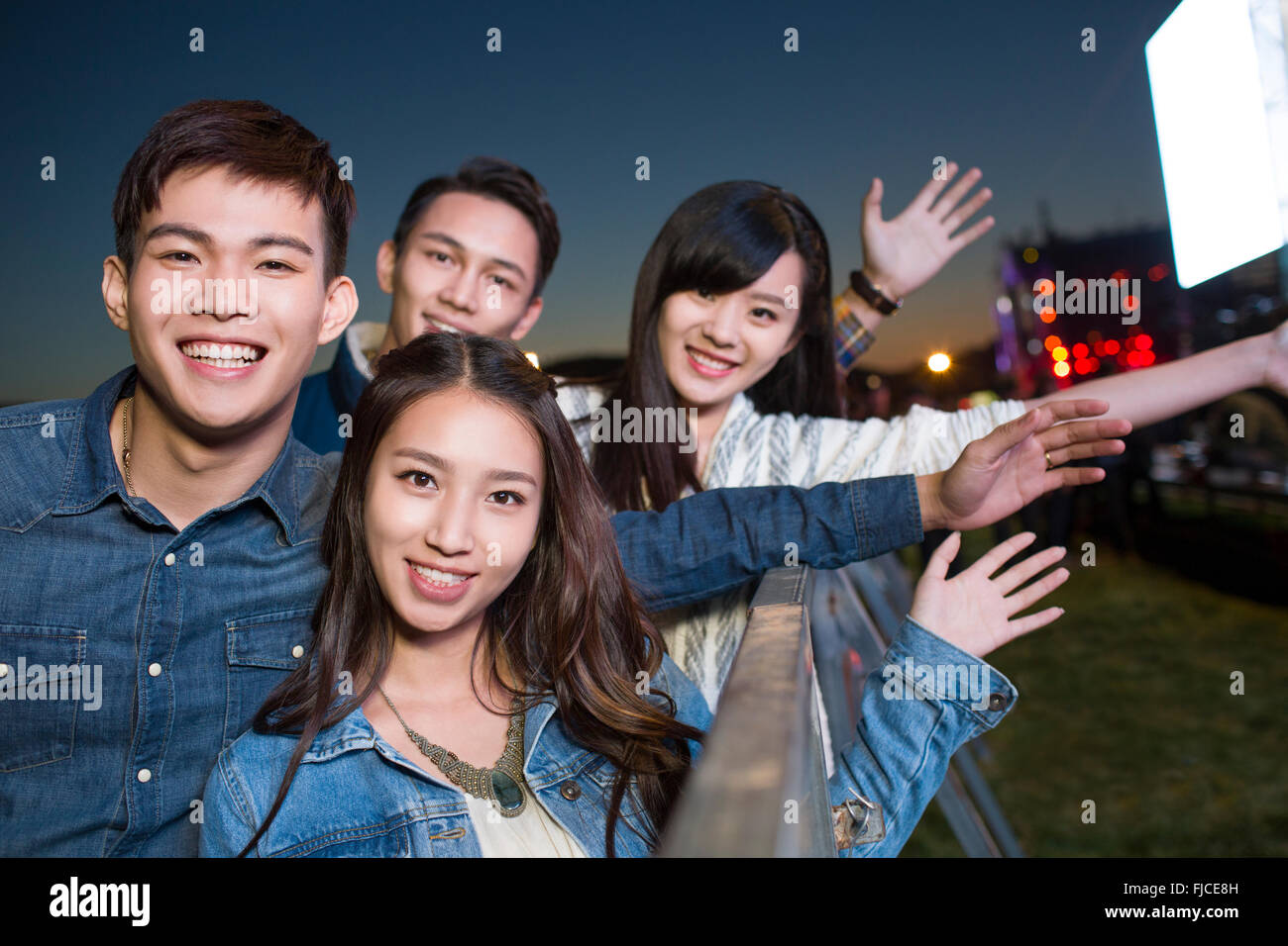 Happy Chinese friends at music festival Stock Photo - Alamy