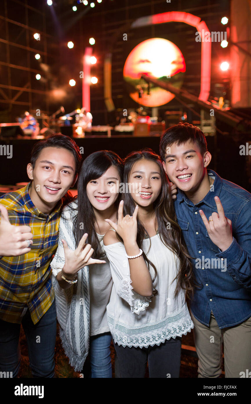 Happy Chinese friends at music festival Stock Photo - Alamy