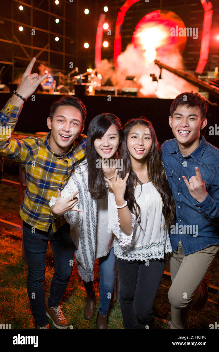Happy Chinese friends at music festival Stock Photo - Alamy