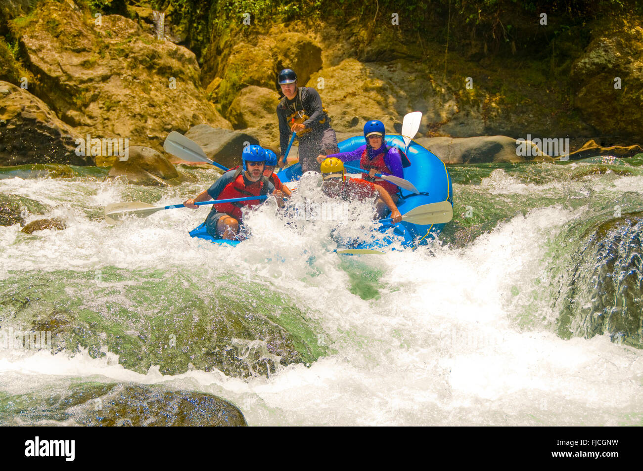 People whitewater rafting through wild rapids, Lower Pacuare River ...