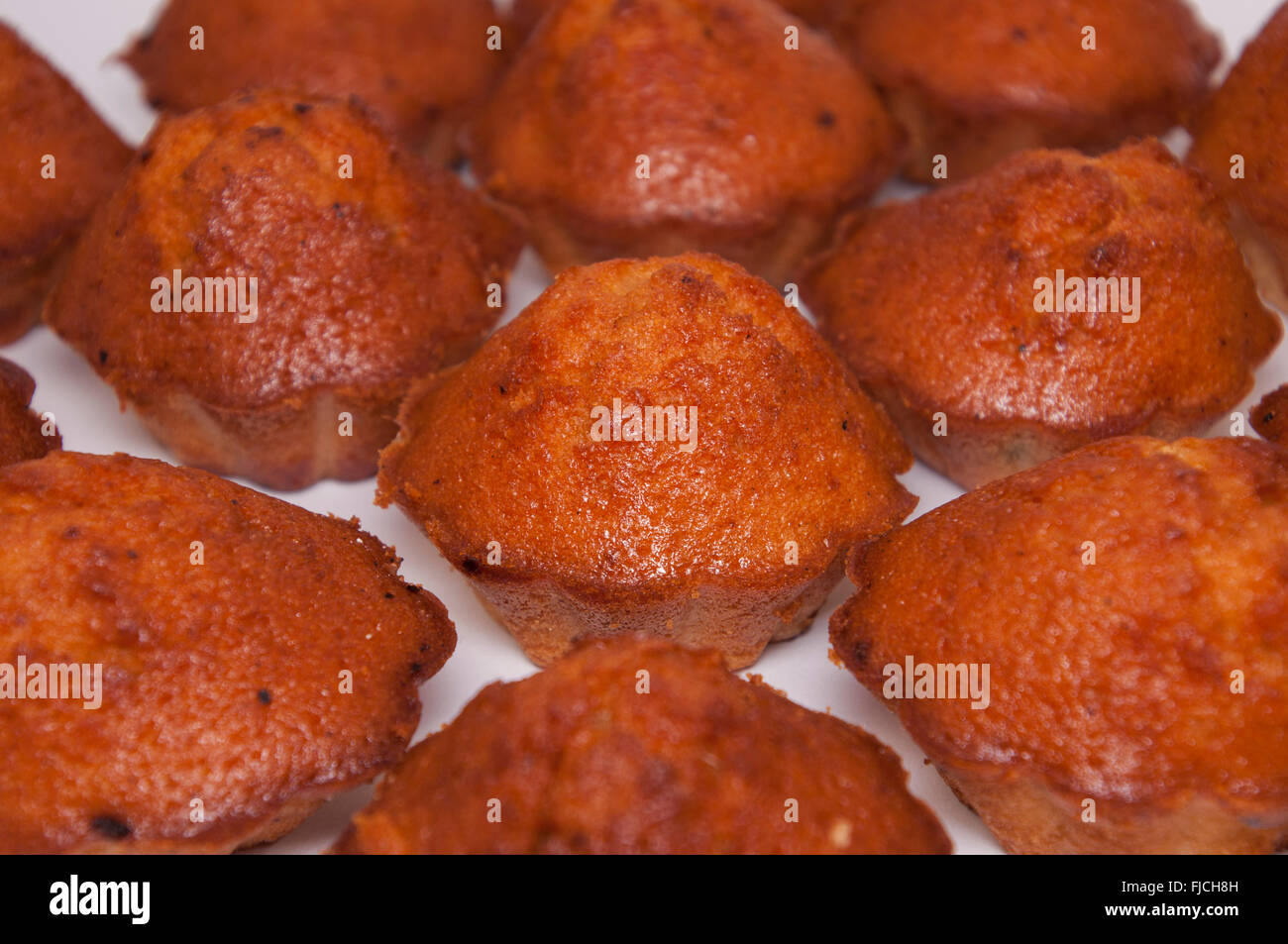 One muffin in focus among pile of other cakes Stock Photo - Alamy