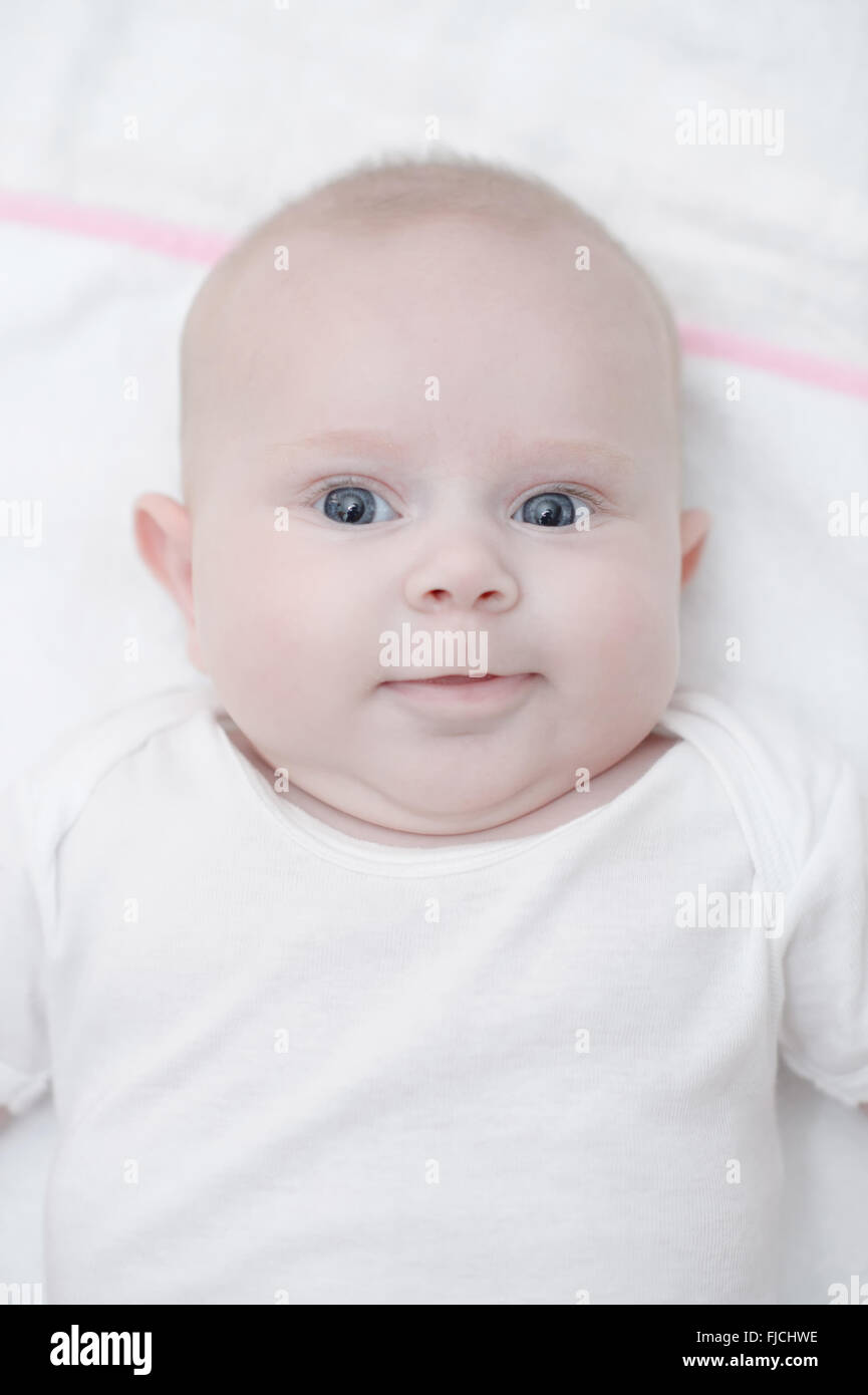 Baby girl posing with bright eyes, baby is newborn and very little ...
