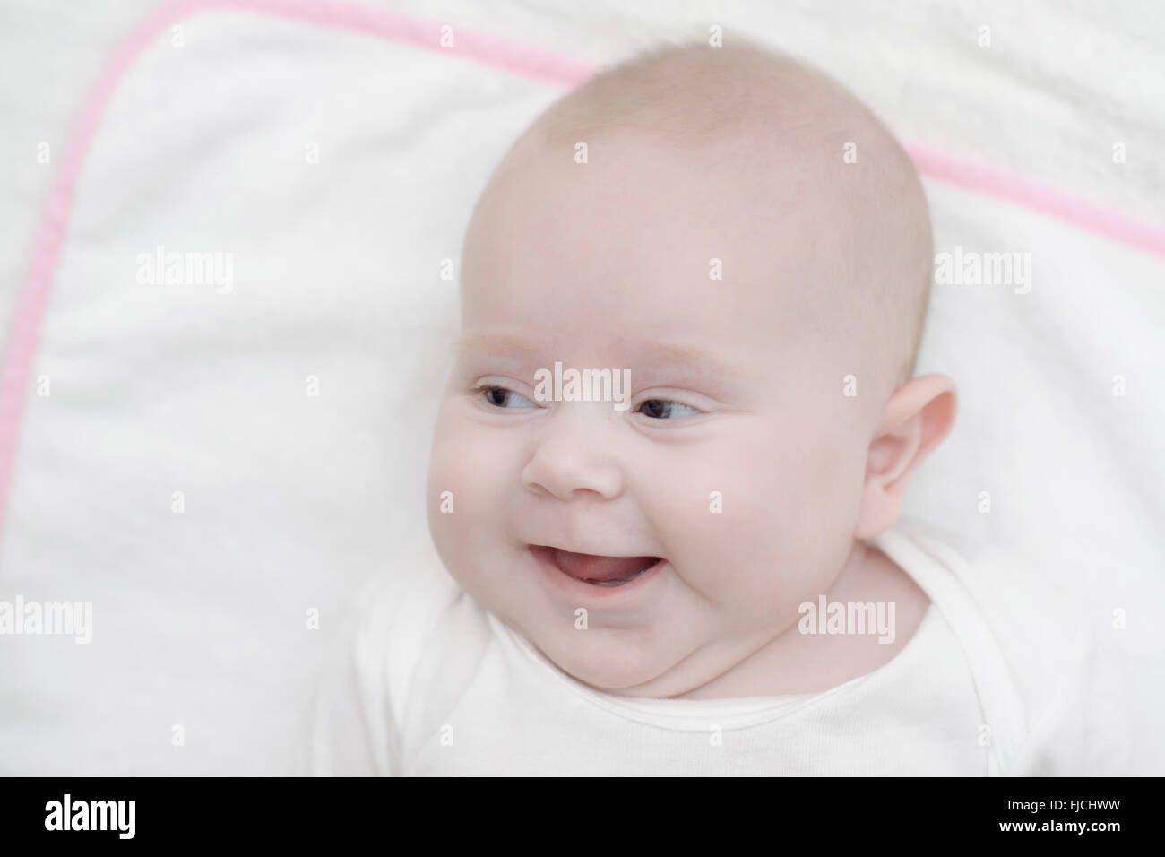 Baby girl posing with bright eyes, baby is newborn and very little ...