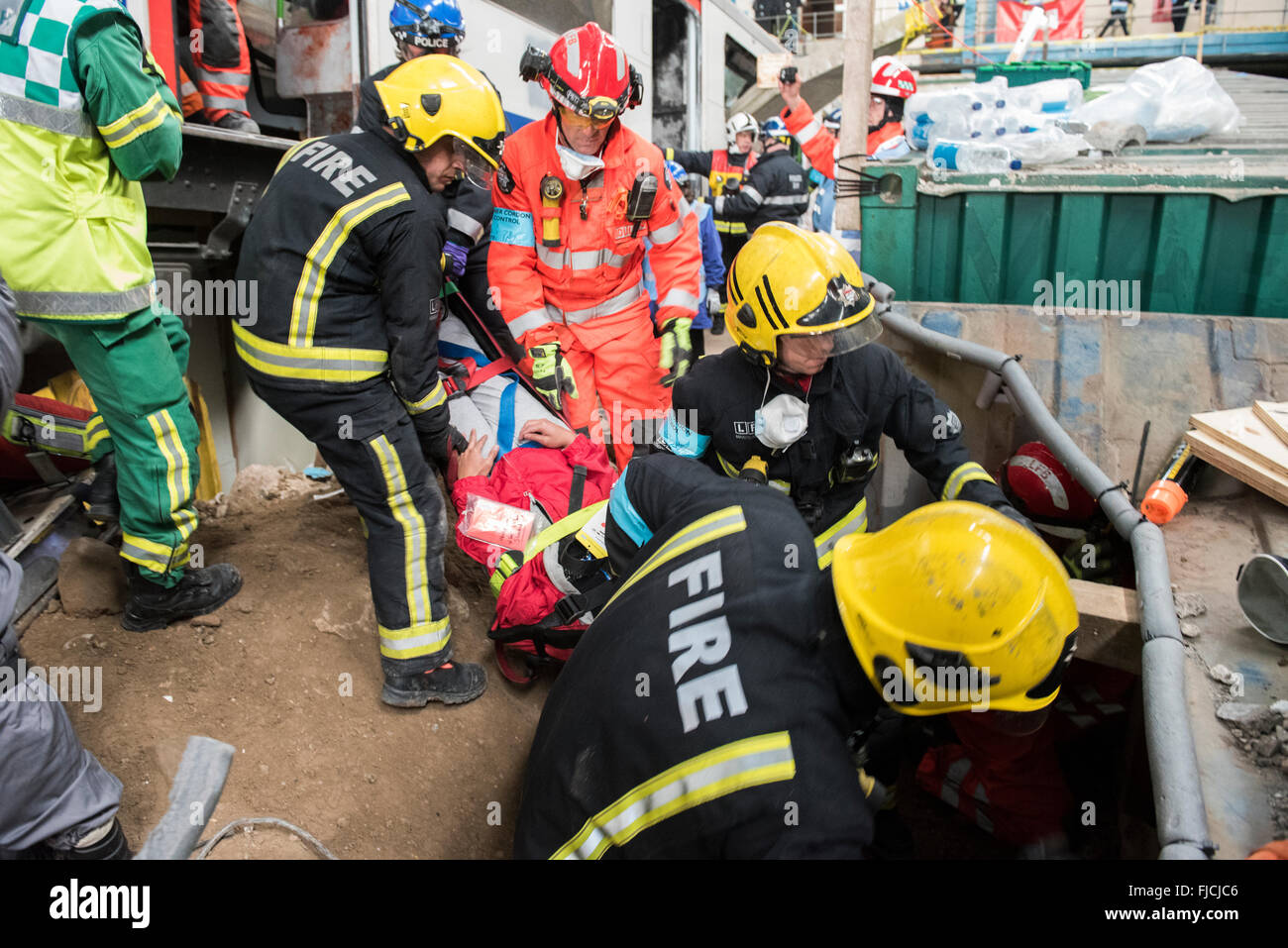 Dartford, London, UK. 1st March 2016. Firefighters extract a victim ...