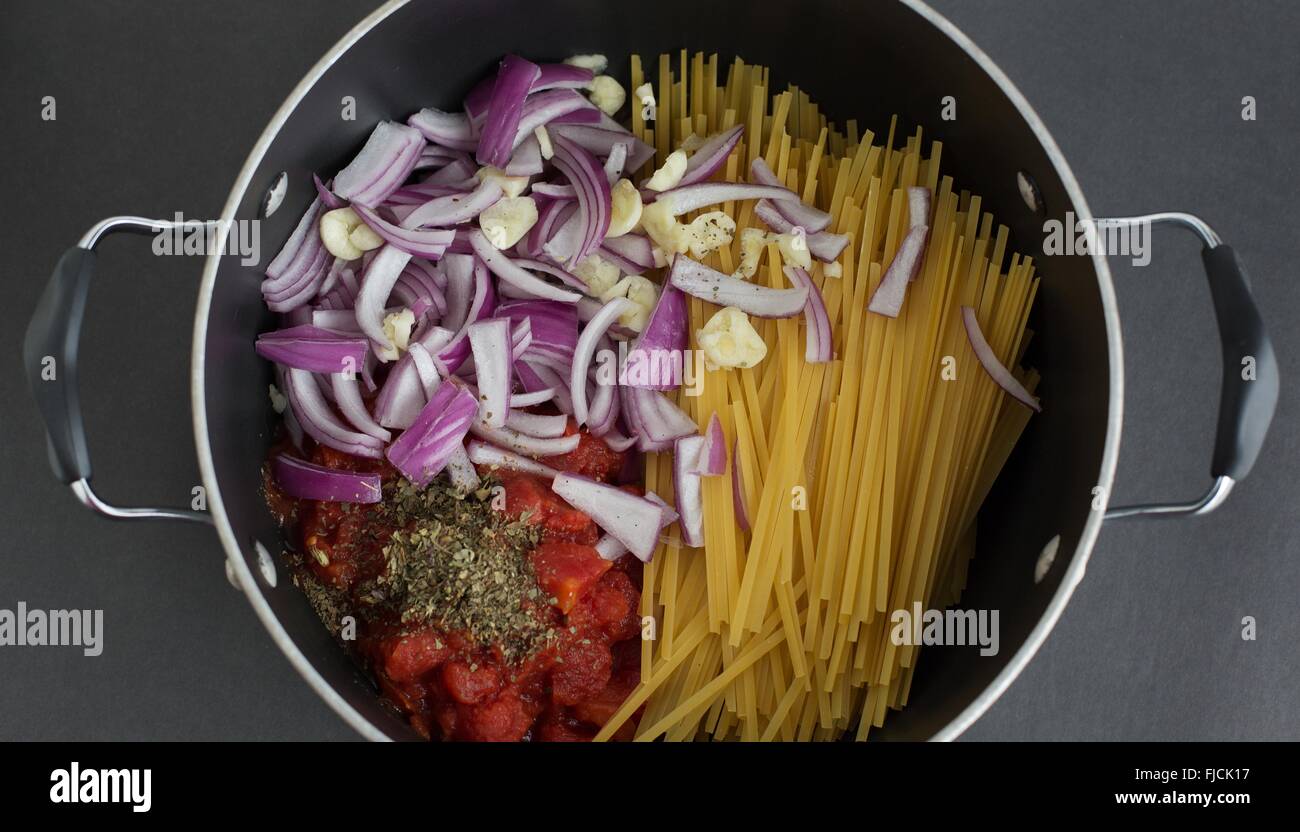 The ingredients for a one pot plant based pasta dish in a pot Stock ...