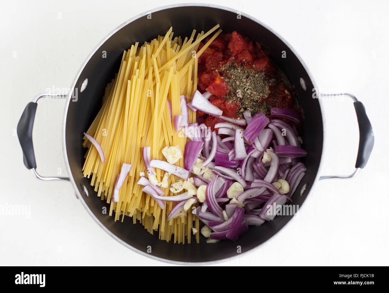 The ingredients for a one pot plant based pasta dish in a pot Stock ...