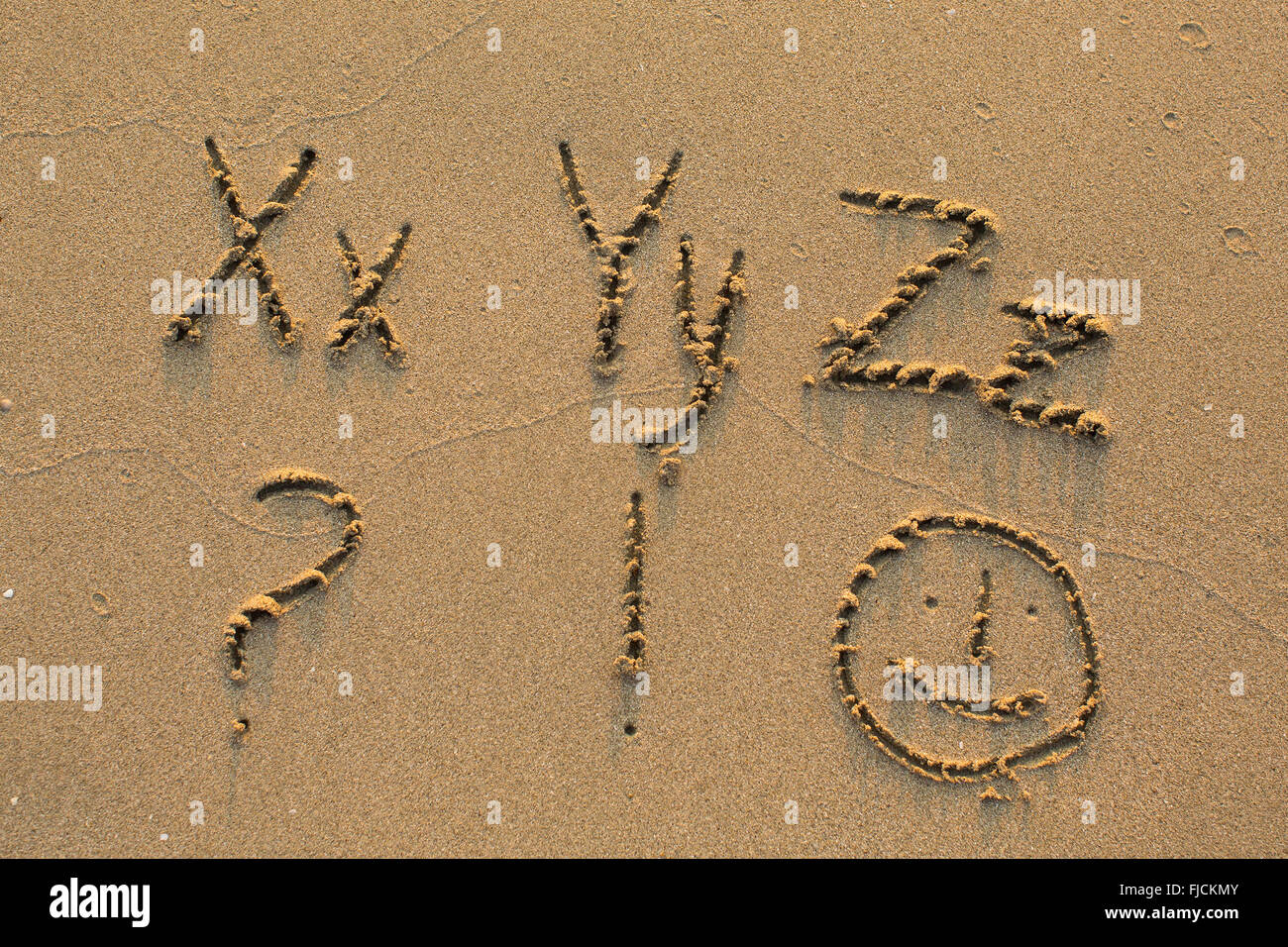 Alphabet written in light beach sand, part 4 of 4 (X-Z Stock Photo - Alamy