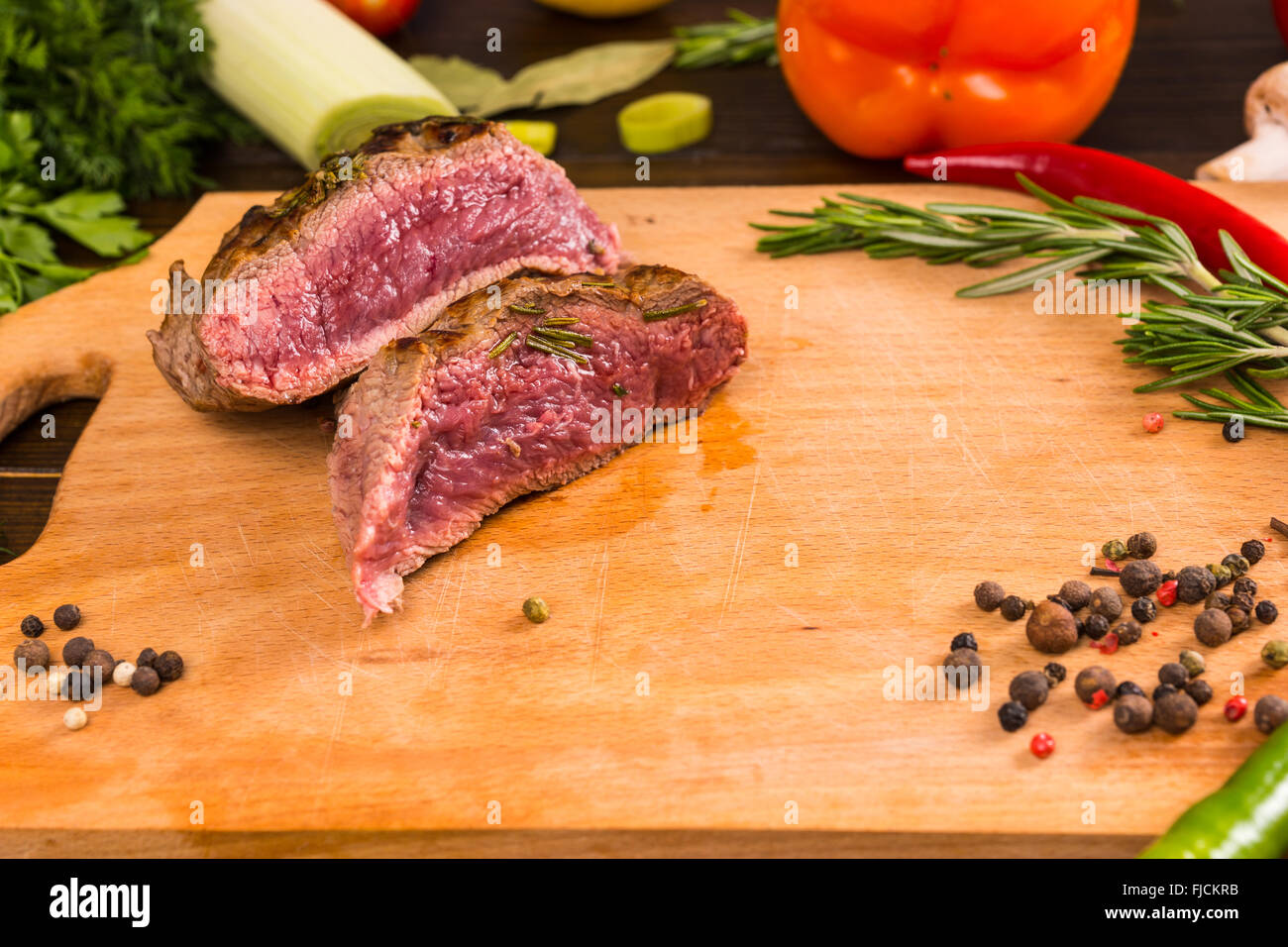 Close Up Still Life View of Rare Cooked Roast Beef Sliced and Resting ...
