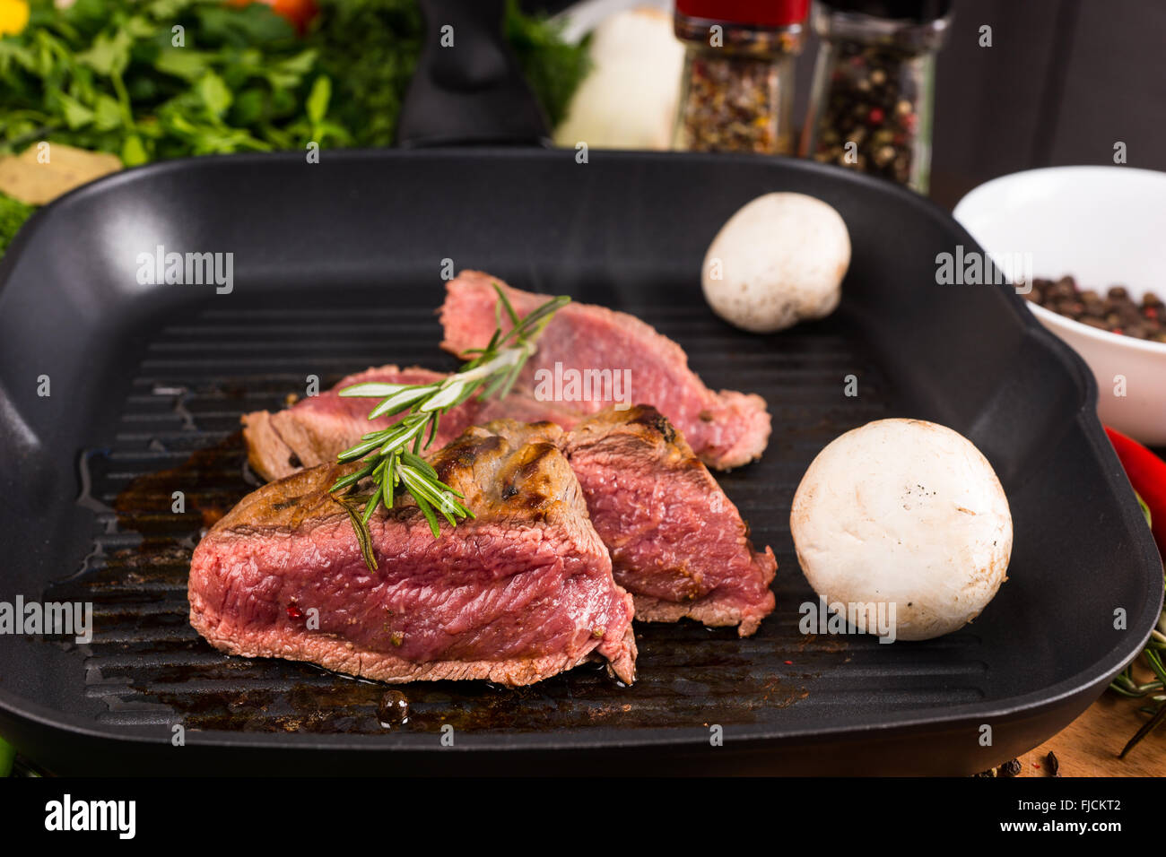 Close Up Still Life of Rare Seasoned Roast Beef Slices Sizzling in Hot ...