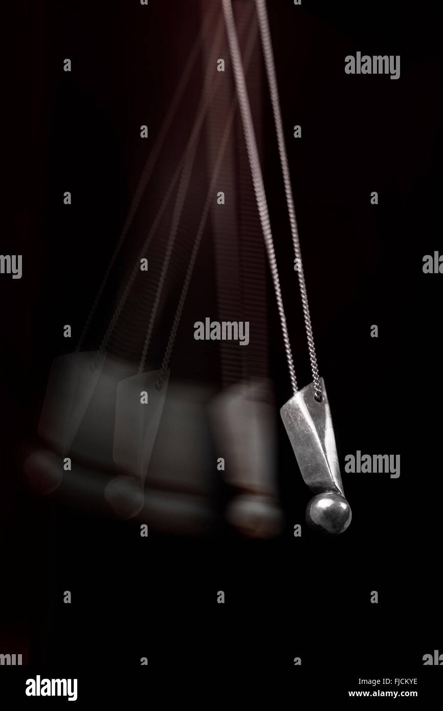 Hypnosis treatment tool swinging back and forth Stock Photo - Alamy