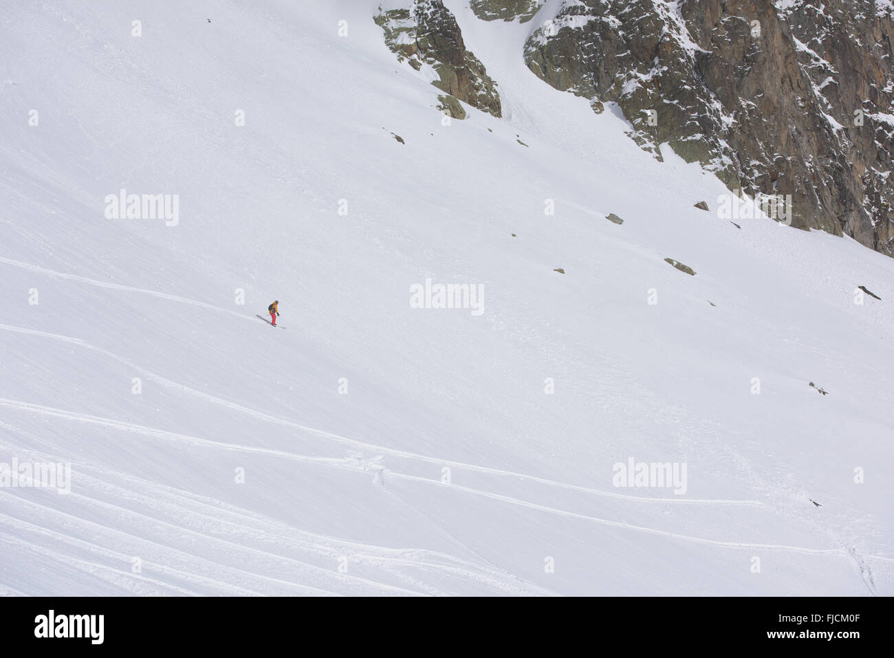 extreme freeride skier skiing on fresh powder snow in downhill at ...