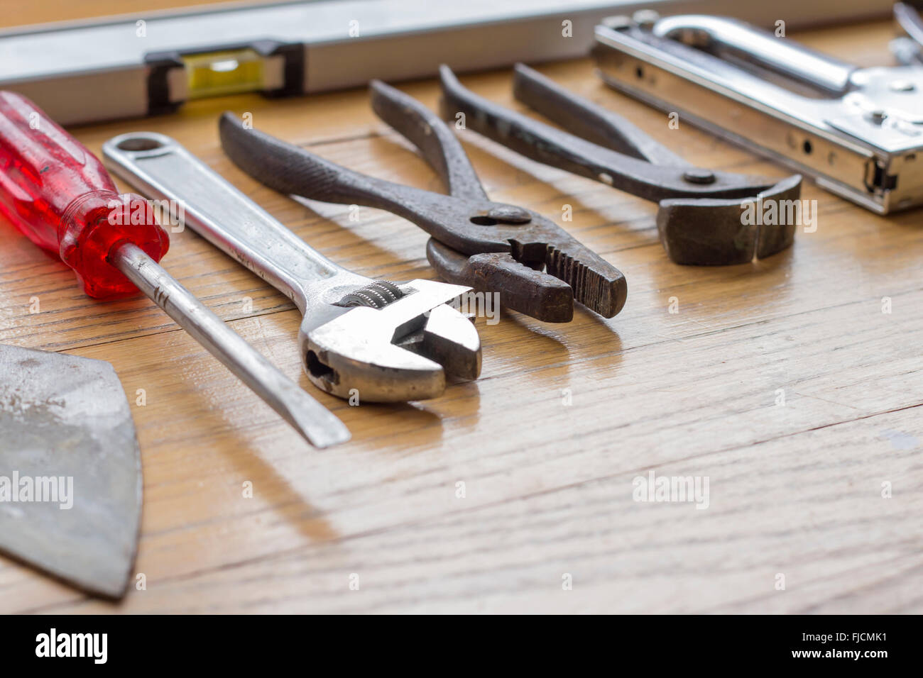 Bunch of workers old worn tools on grunge wood surface Stock Photo - Alamy
