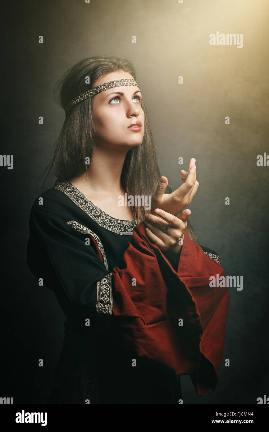 Medieval woman with eyes to soft holy light. Historical and religion ...