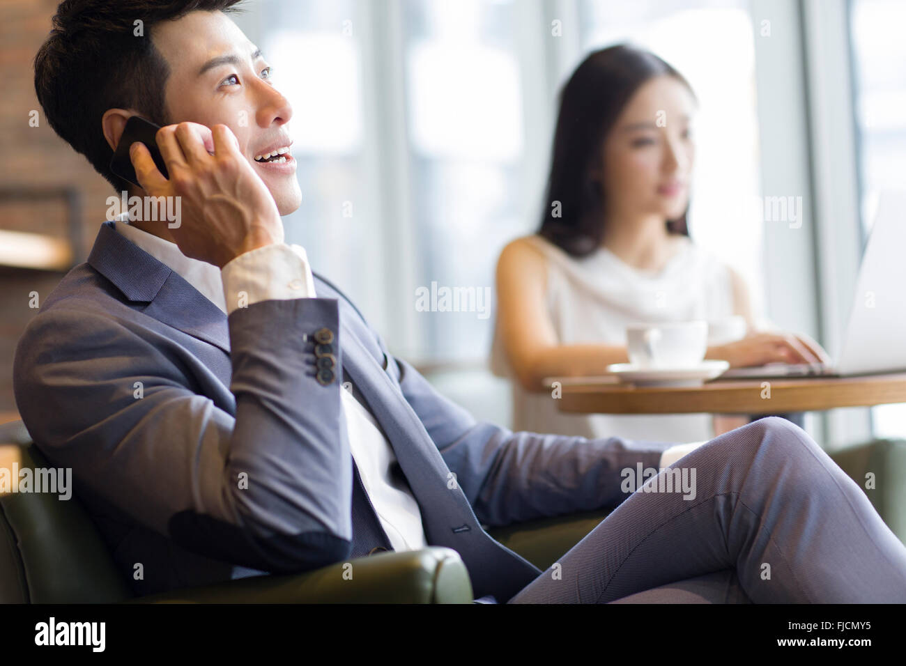 Chinese businessman talking on the phone Stock Photo - Alamy