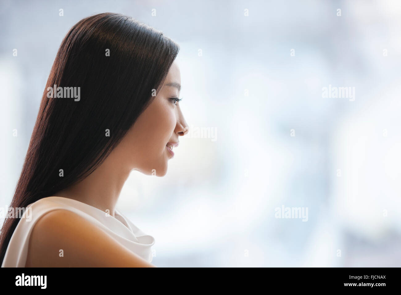 Profile of young Chinese woman Stock Photo - Alamy