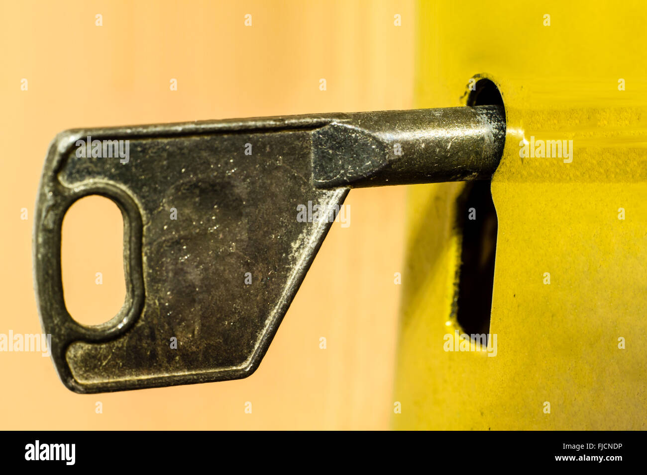 old rusty key is sitting in the door eye Stock Photo - Alamy