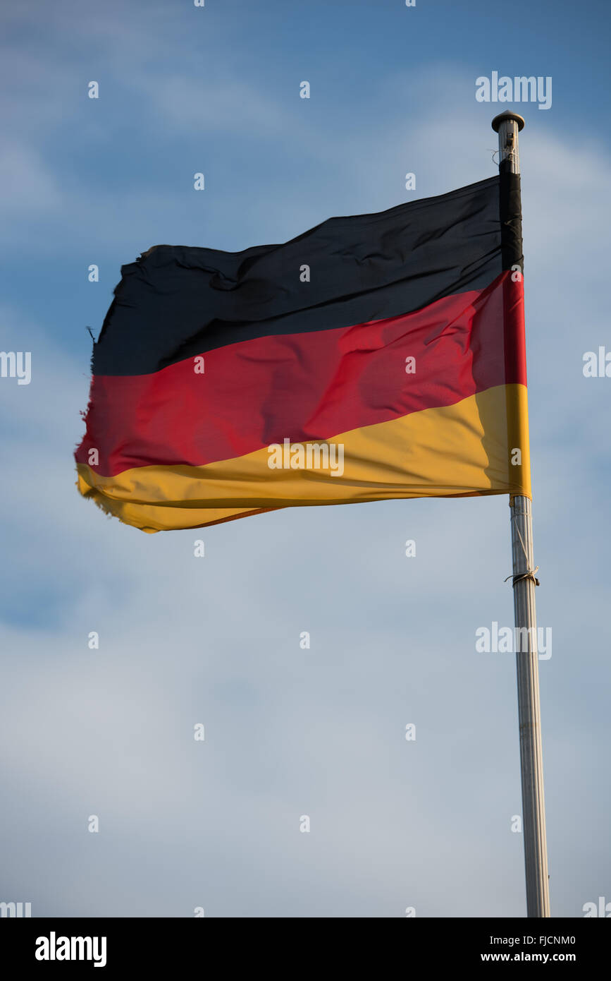 German flags in front of the dark autumn sky Stock Photo - Alamy
