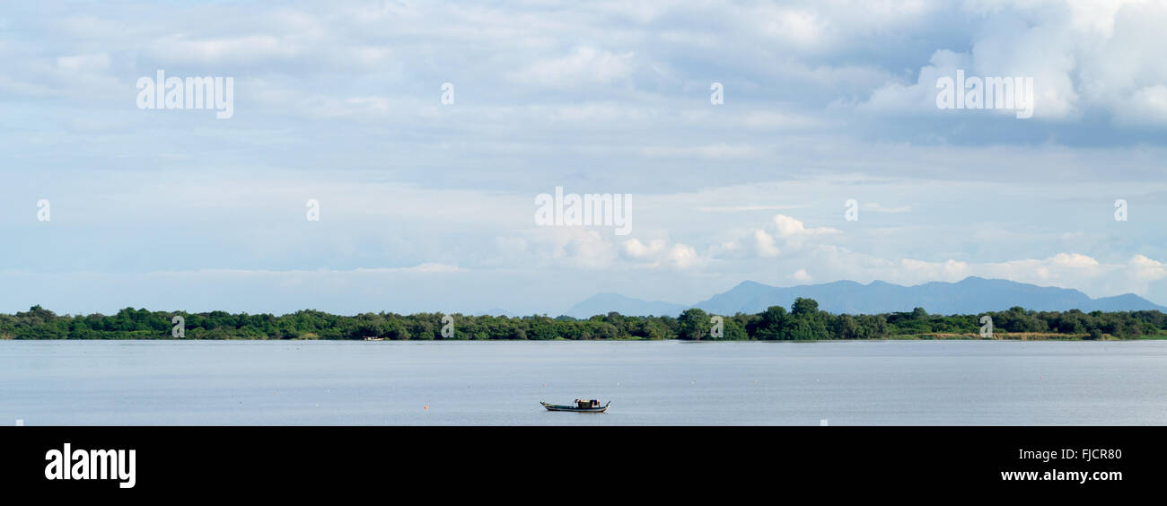 Spectacular seafront view with a lonely bo Stock Photo - Alamy