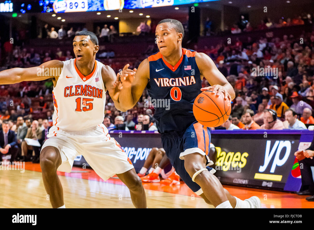 Virginia Cavaliers guard Devon Hall (0) dribbles by Clemson Tigers ...