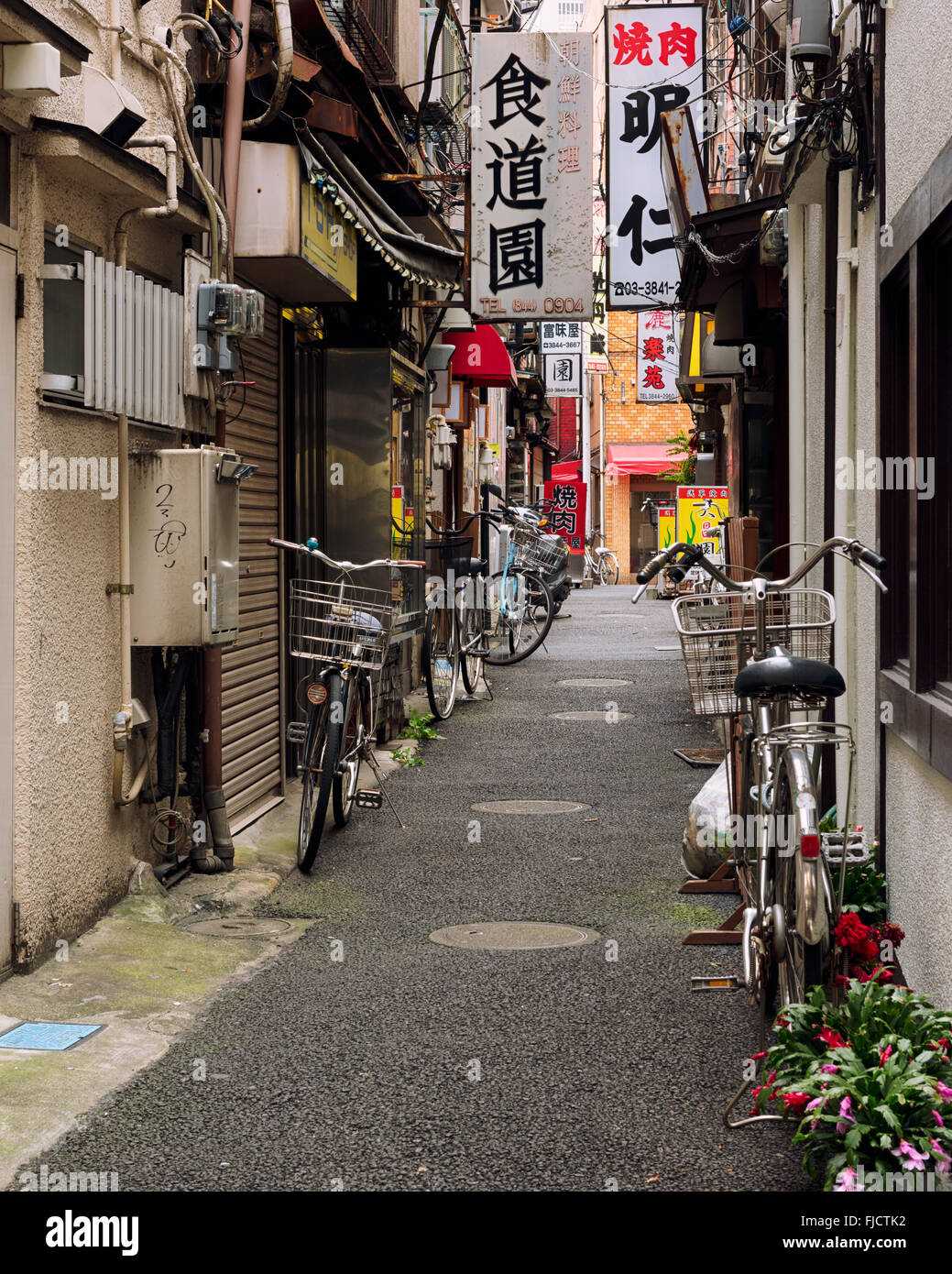 Tokyo; Japan -January 07: Narrow street with several Japanese ...