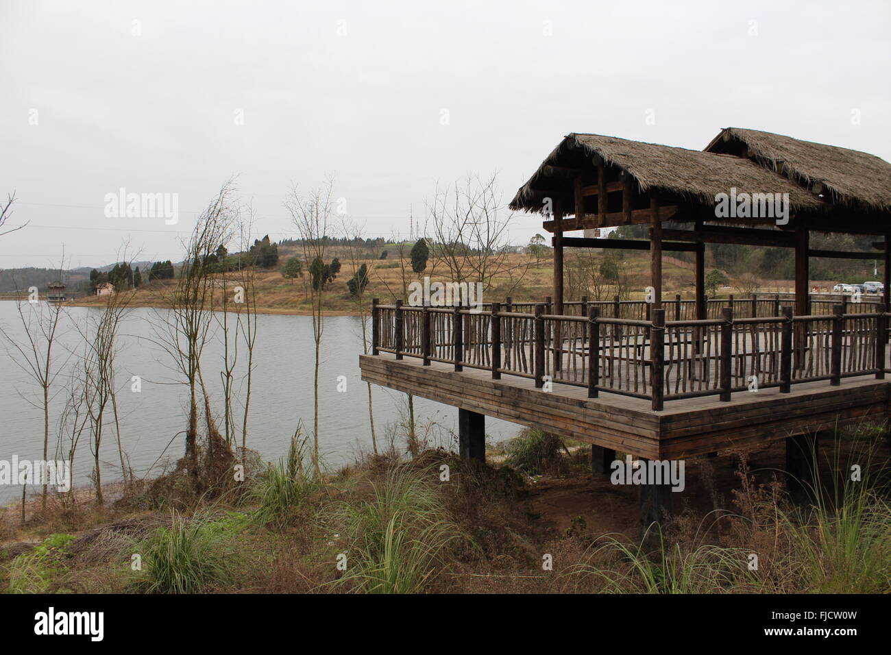 Lakeside thatch pavilion Stock Photo - Alamy