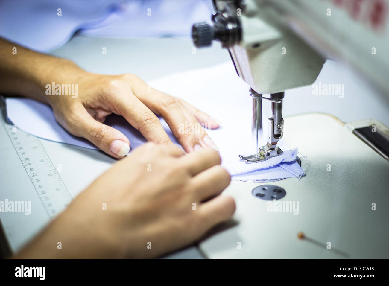 Woman works on sewing machine hi-res stock photography and images - Alamy