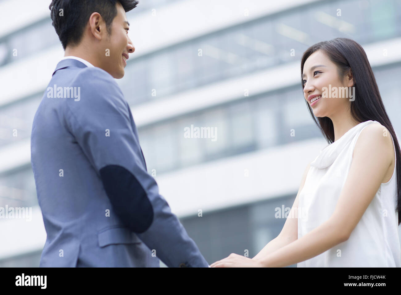 Chinese businesspeople shaking hands Stock Photo - Alamy