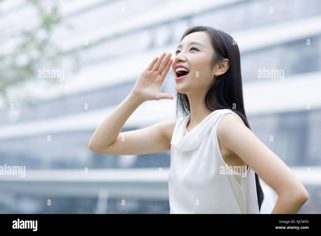 Young Chinese woman shouting Stock Photo - Alamy