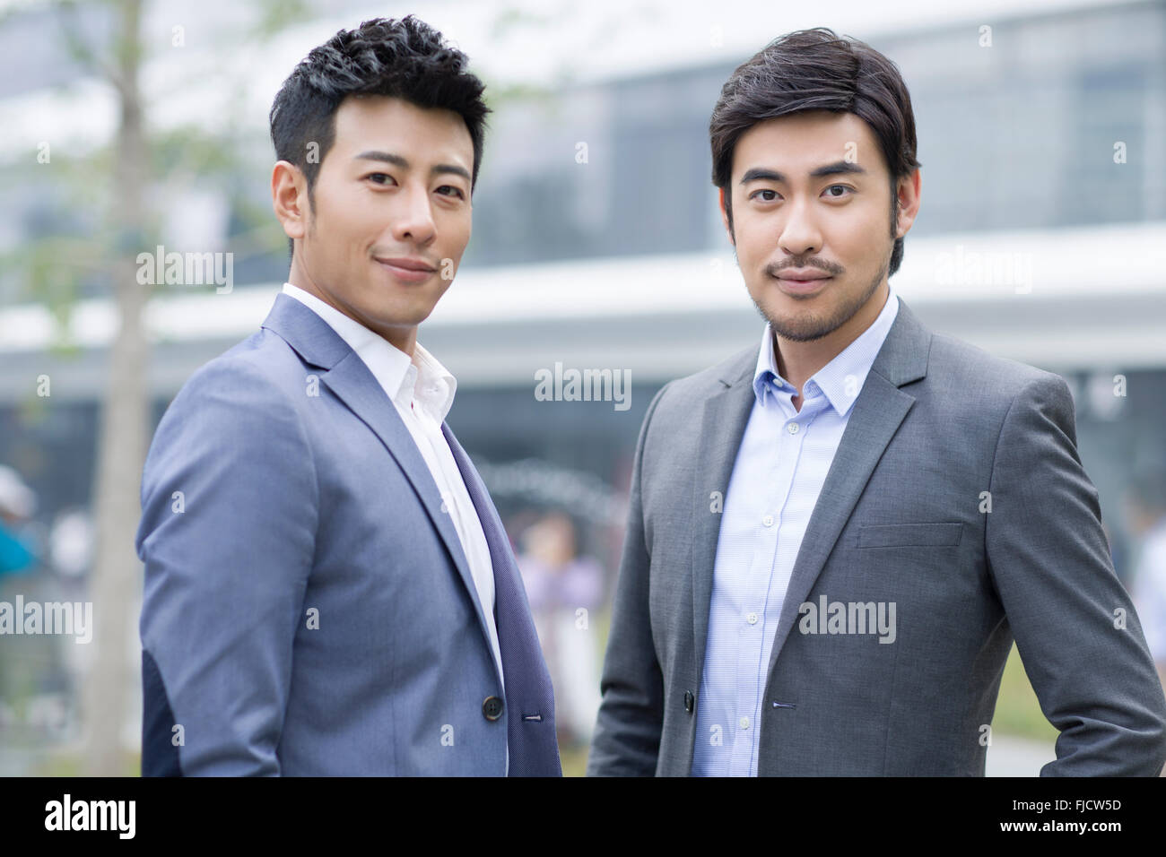 Portrait of confident Chinese businessmen Stock Photo - Alamy