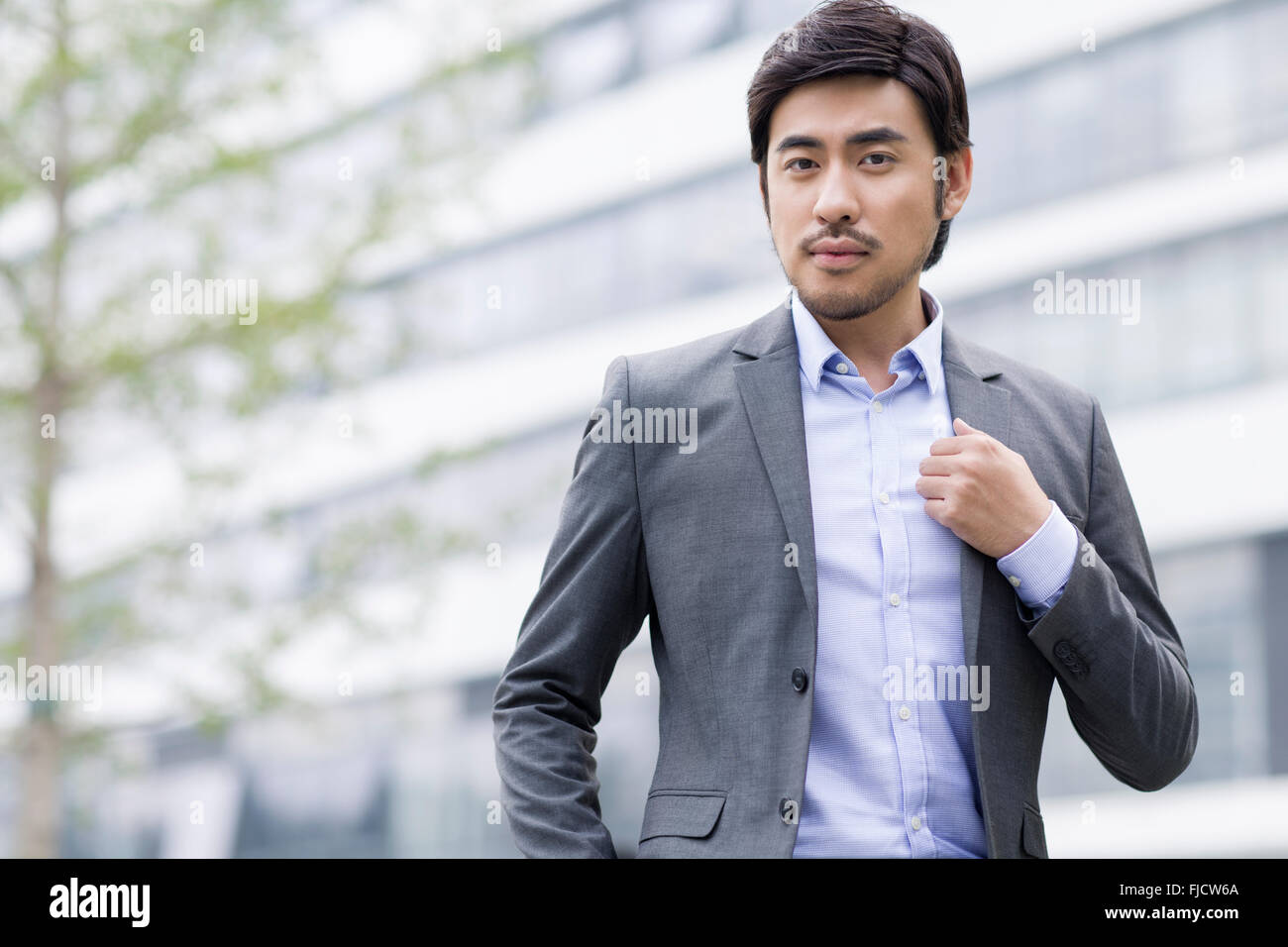 Portrait of confident Chinese businessman Stock Photo - Alamy