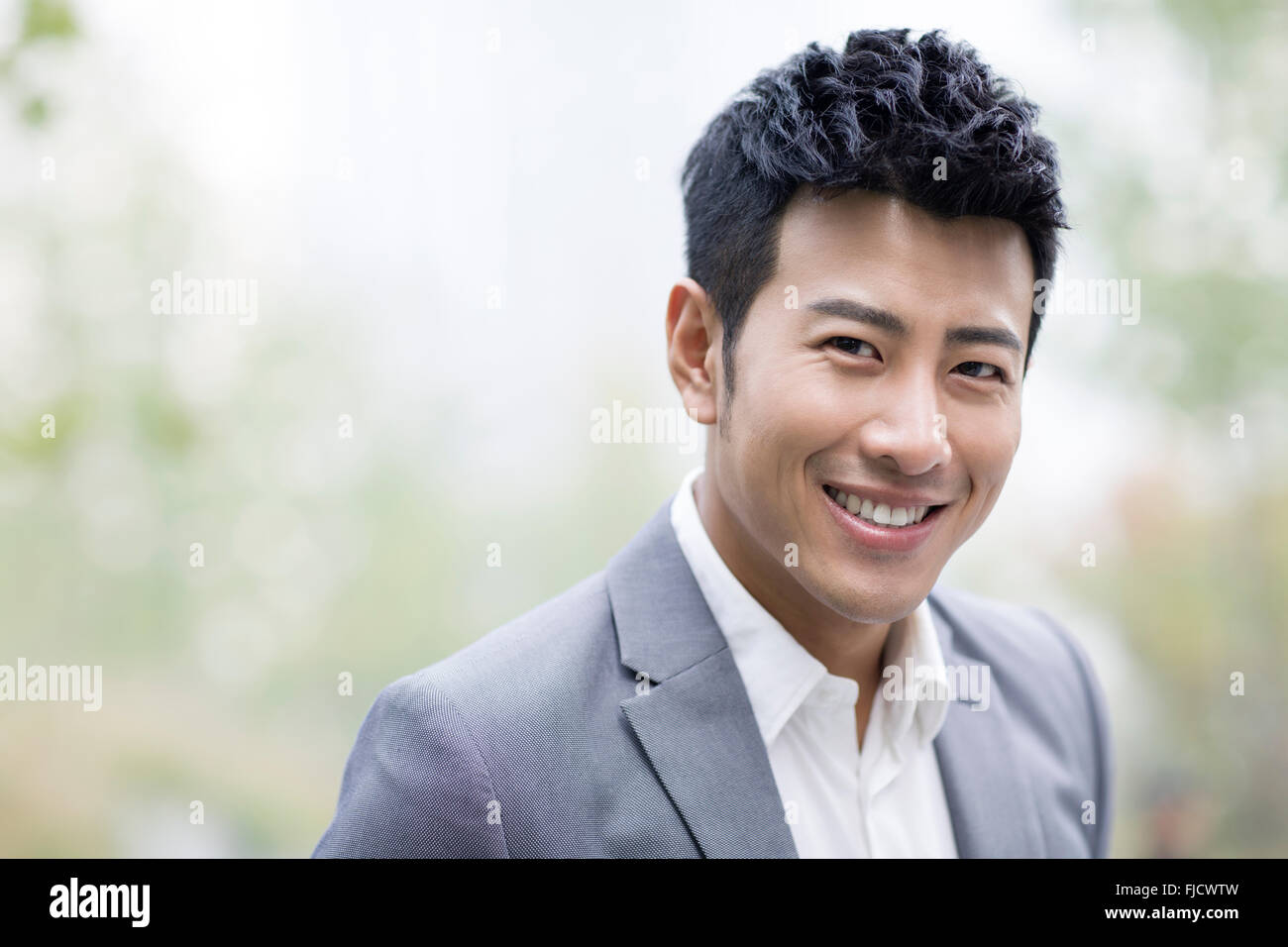 Portrait of confident Chinese businessman Stock Photo - Alamy