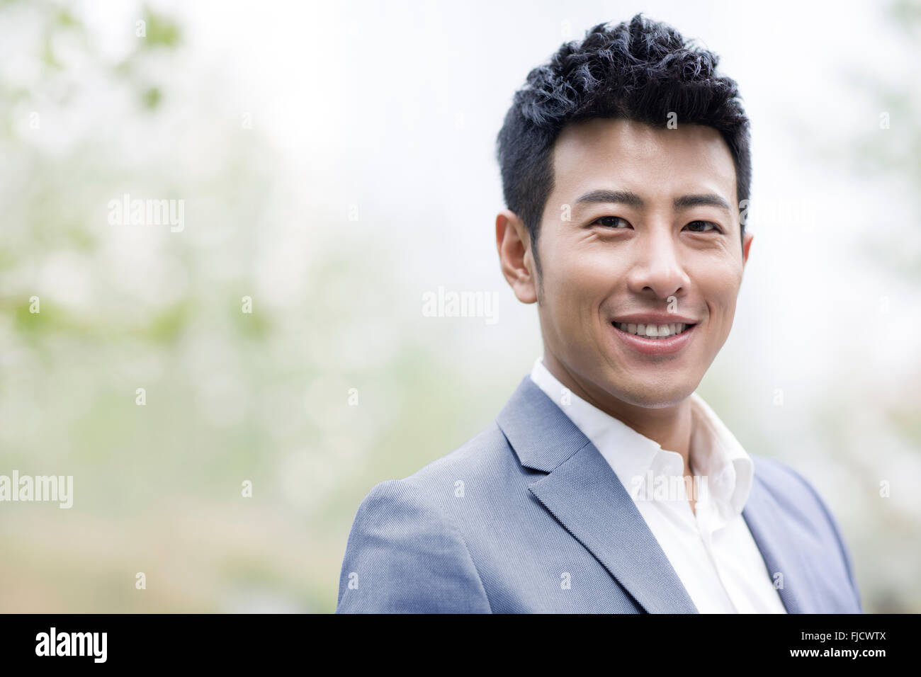 Portrait of confident Chinese businessman Stock Photo - Alamy